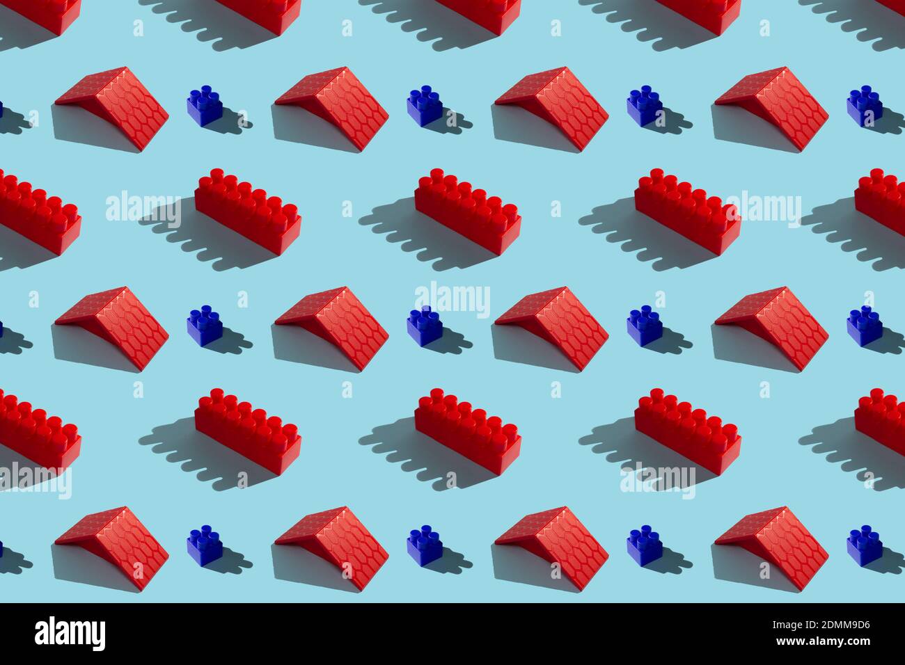 The roof and construction blocks are red and blue on a blue background ...