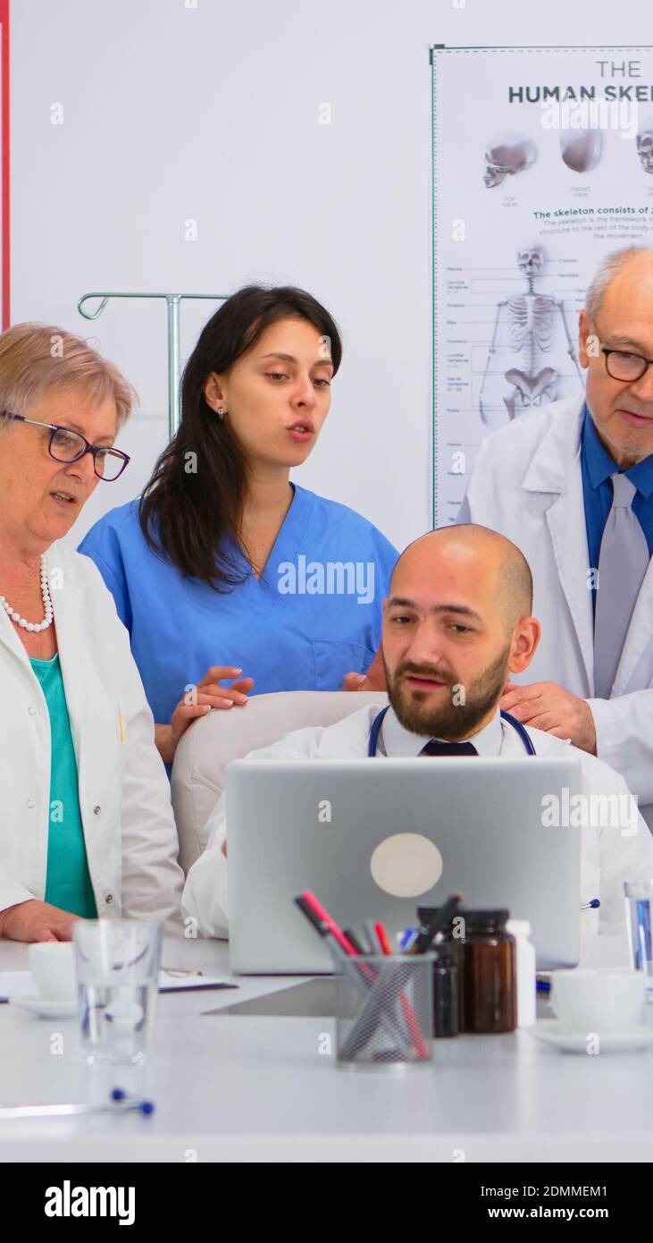 Group of doctors having health brainstorming conference in hospital ...