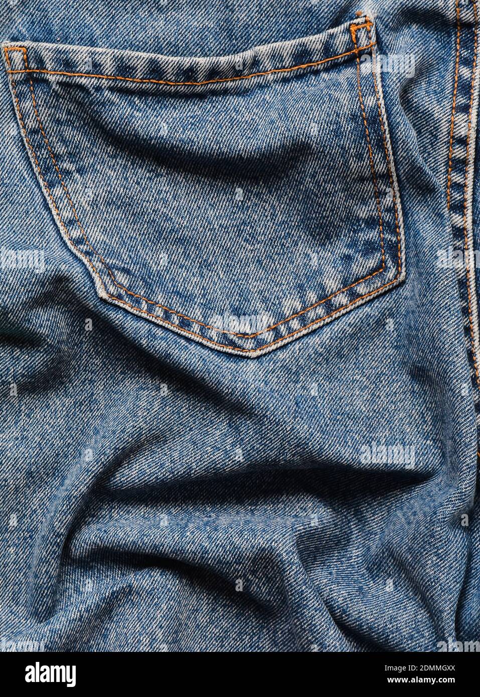 The texture of the back pocket of the wrinkled jeans Stock Photo - Alamy
