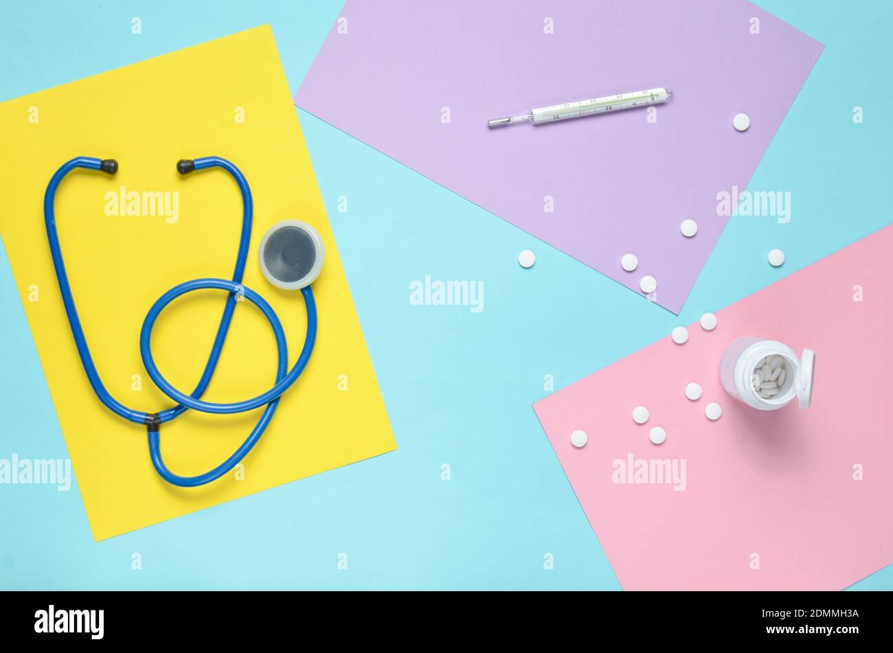 Medical equipment on a colored paper background. Stethoscope ...