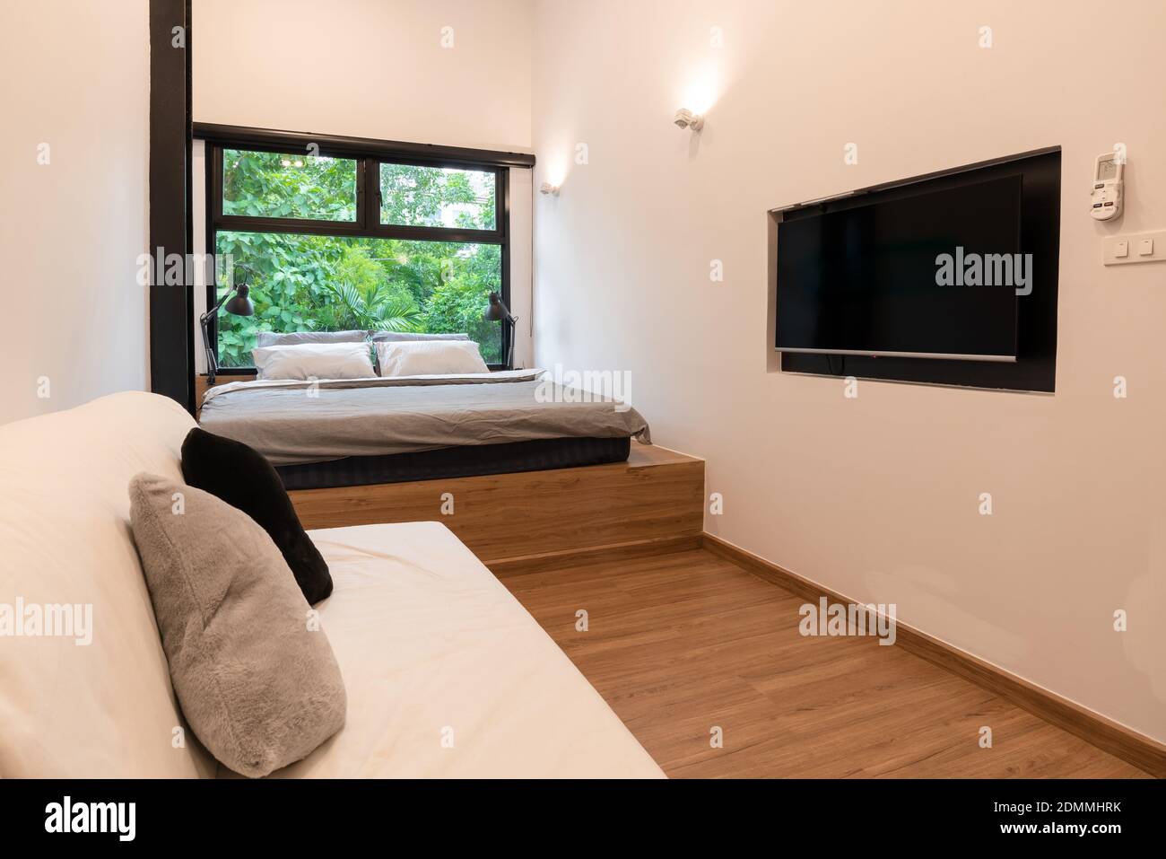 Bedroom with fresh nature green tree view through the window Stock ...