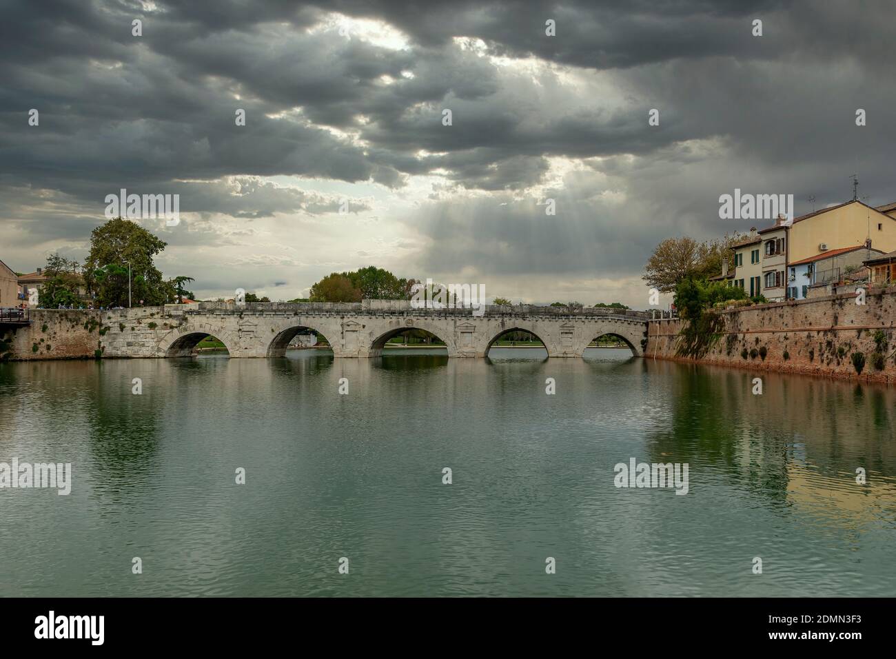 The ancient Tiberius Bridge in Rimini, Italy, under a dramatic sky ...