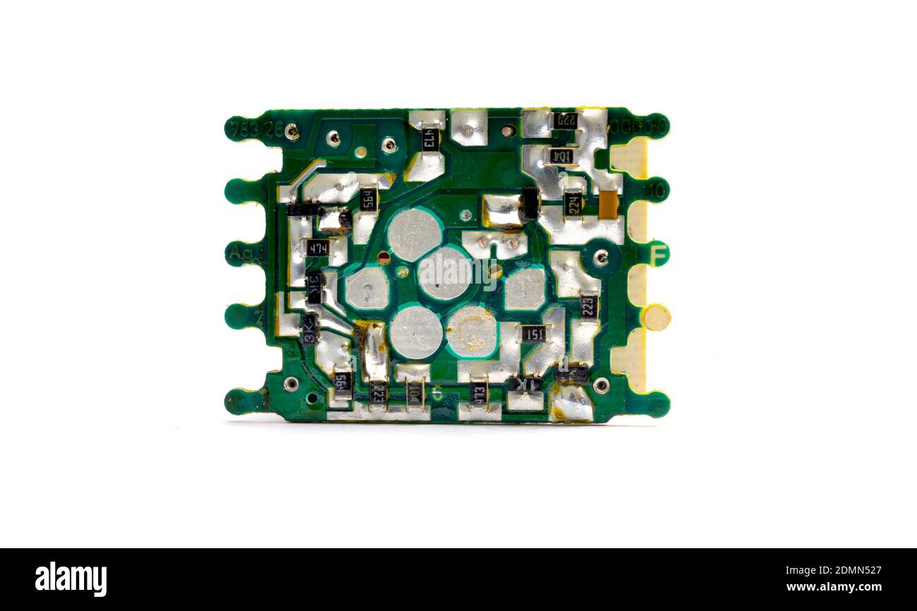 Cracked disassembled broken small vintage electronic device on white ...