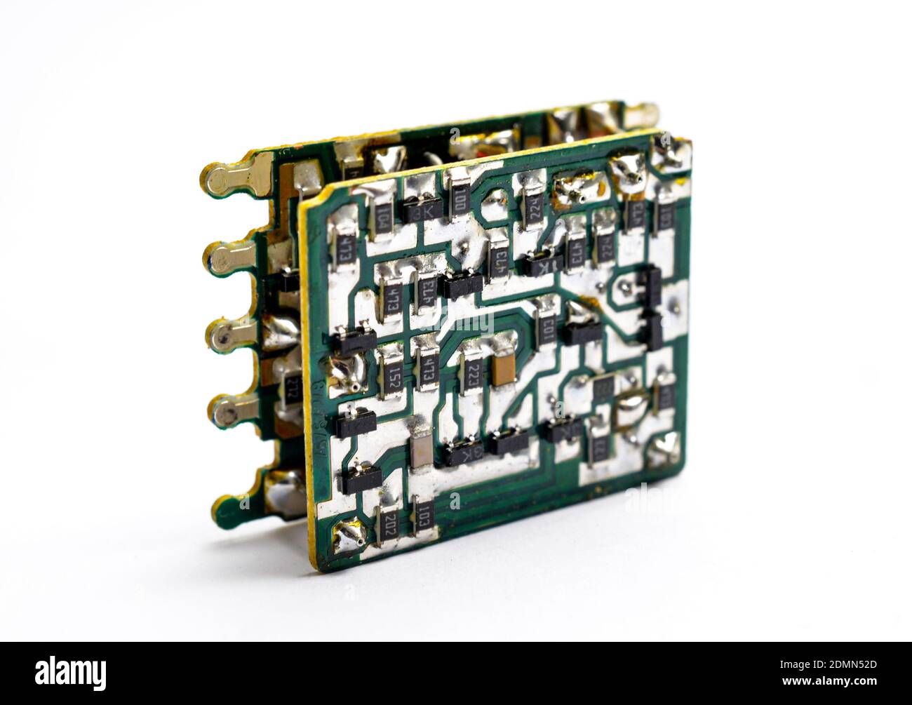 Cracked disassembled broken small vintage electronic device on white ...
