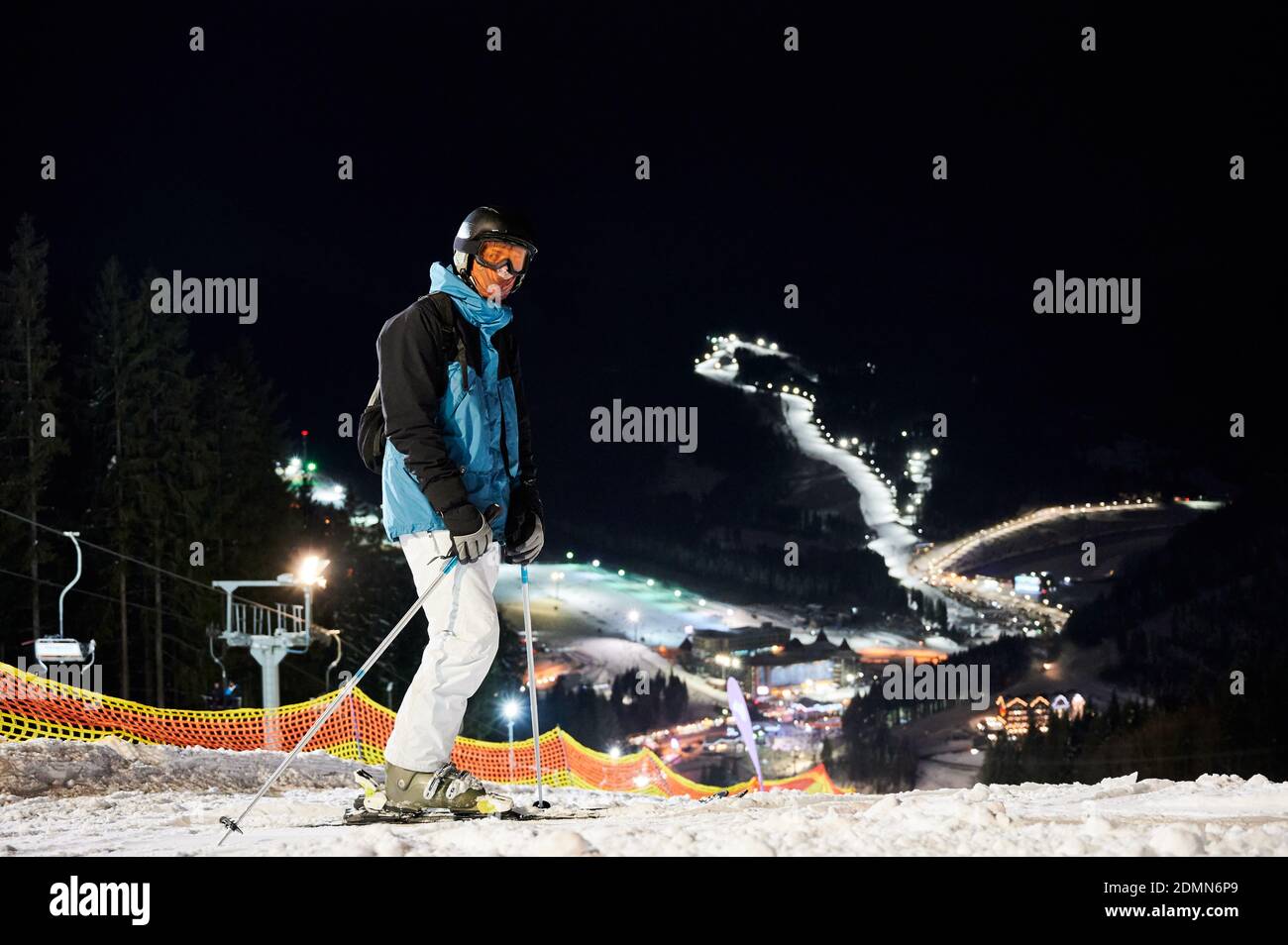 Skier standing at the ski slope holding ski hi-res stock photography ...