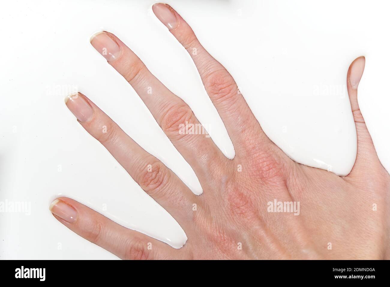 women hand dipped in white color Stock Photo - Alamy