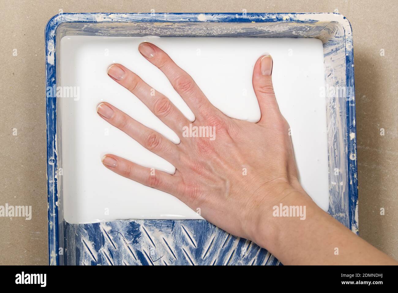 women hand dipped in white color Stock Photo - Alamy