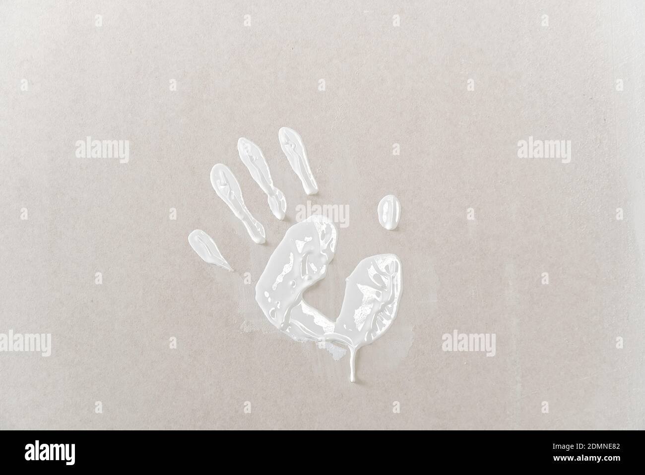 Hand print made with white paint on drywall. painter have fun Stock ...