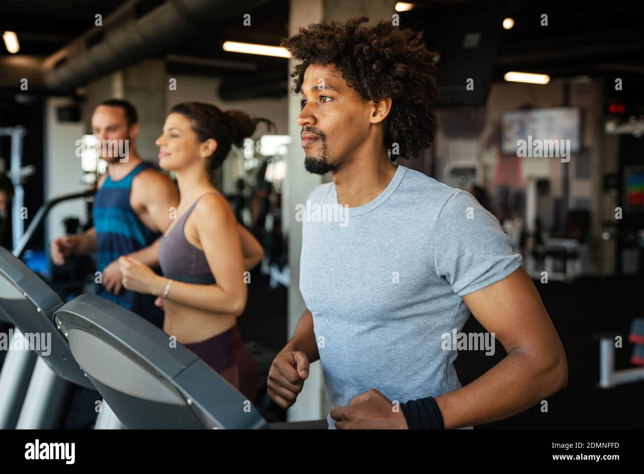Female running on treadmills hi-res stock photography and images - Alamy
