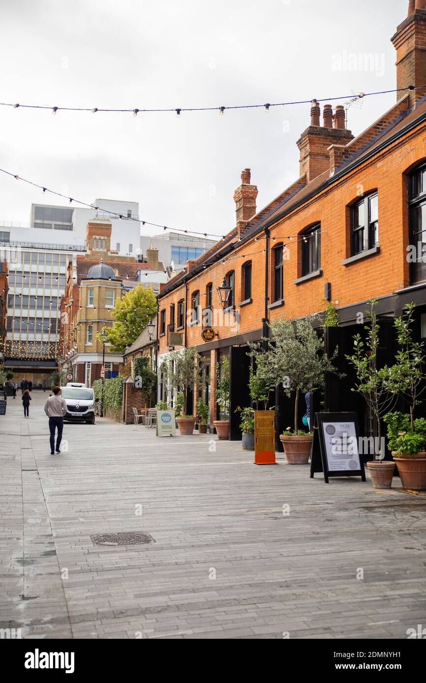 Row of brick buildings with restaurants in Pavilion Road Stock Photo ...