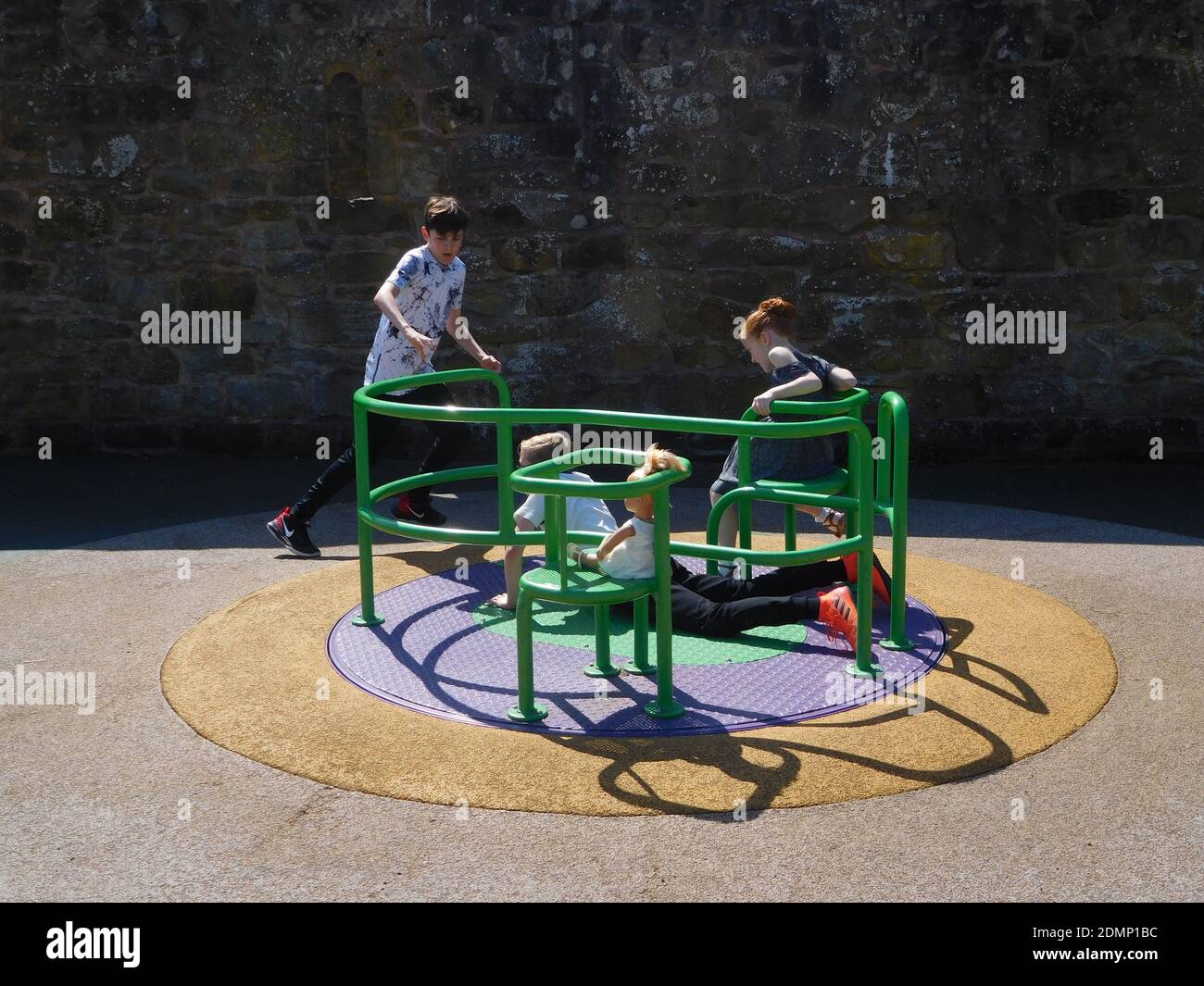 Children Playing On Merry-go-round Stock Photo - Alamy