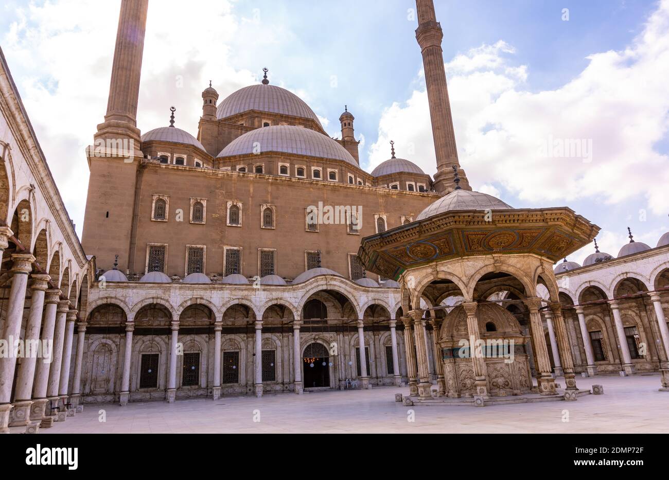 The courtyard of the Alabaster Mosque under a blue cloudy sky and ...
