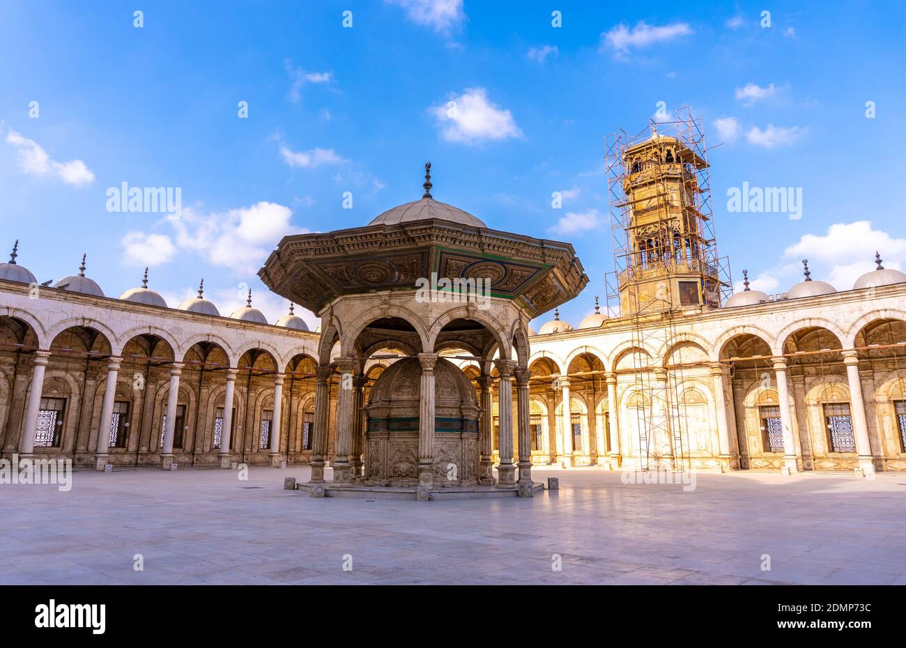 The courtyard of the Alabaster Mosque under a blue cloudy sky and ...