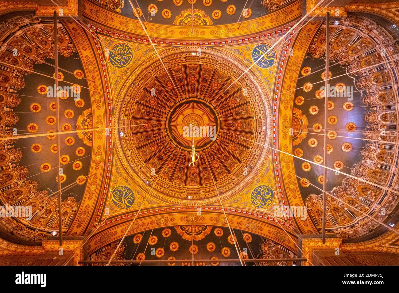 A low angle shot of the Alabaster Mosque ceiling surrounded by lights ...