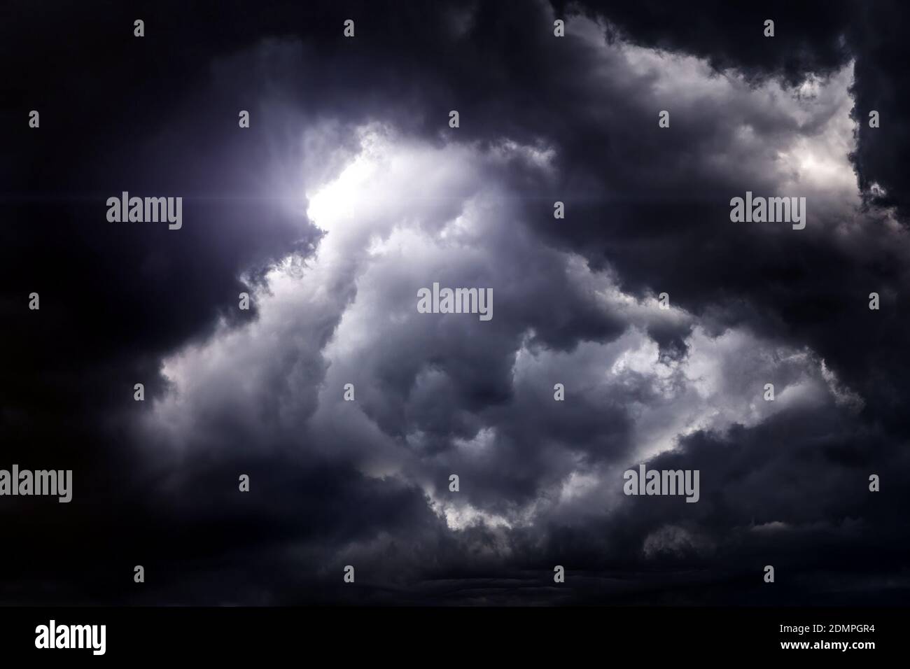 Light in the Dark and Dramatic Storm Clouds Stock Photo - Alamy