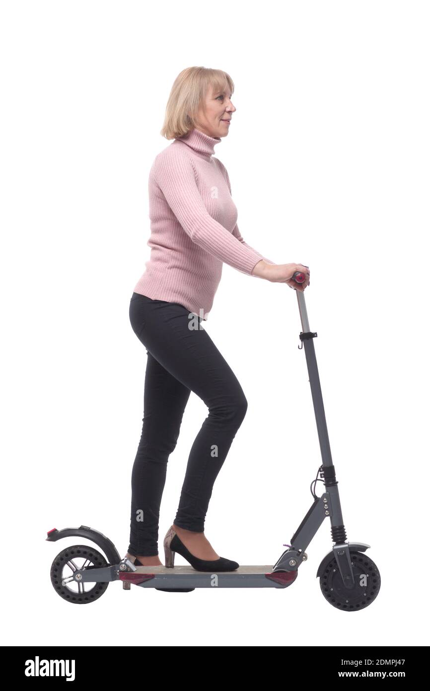 Beautiful woman riding an electric scooter isolated on white background ...