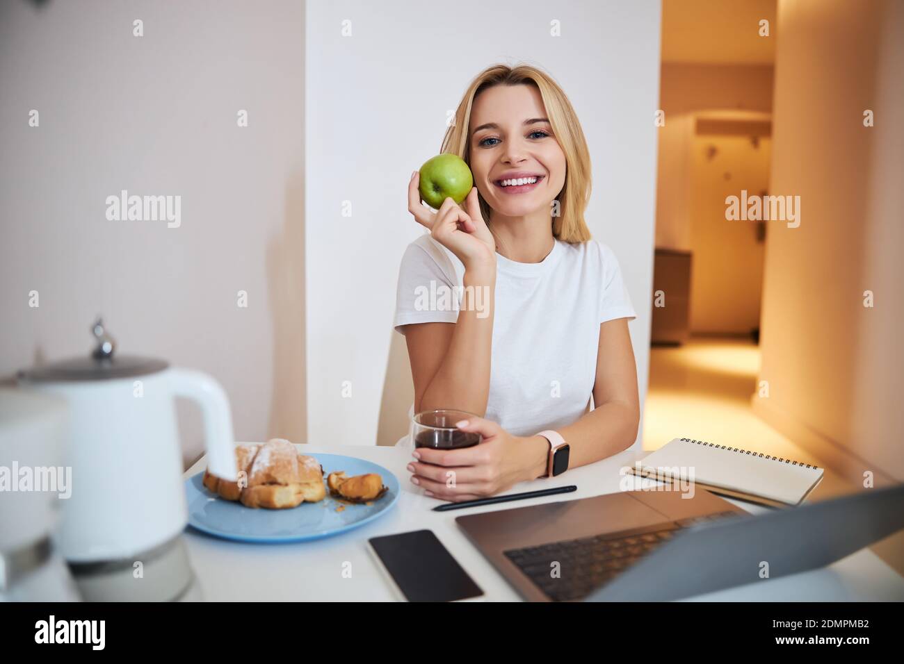 Cheerful female person having pause for lunch Stock Photo - Alamy