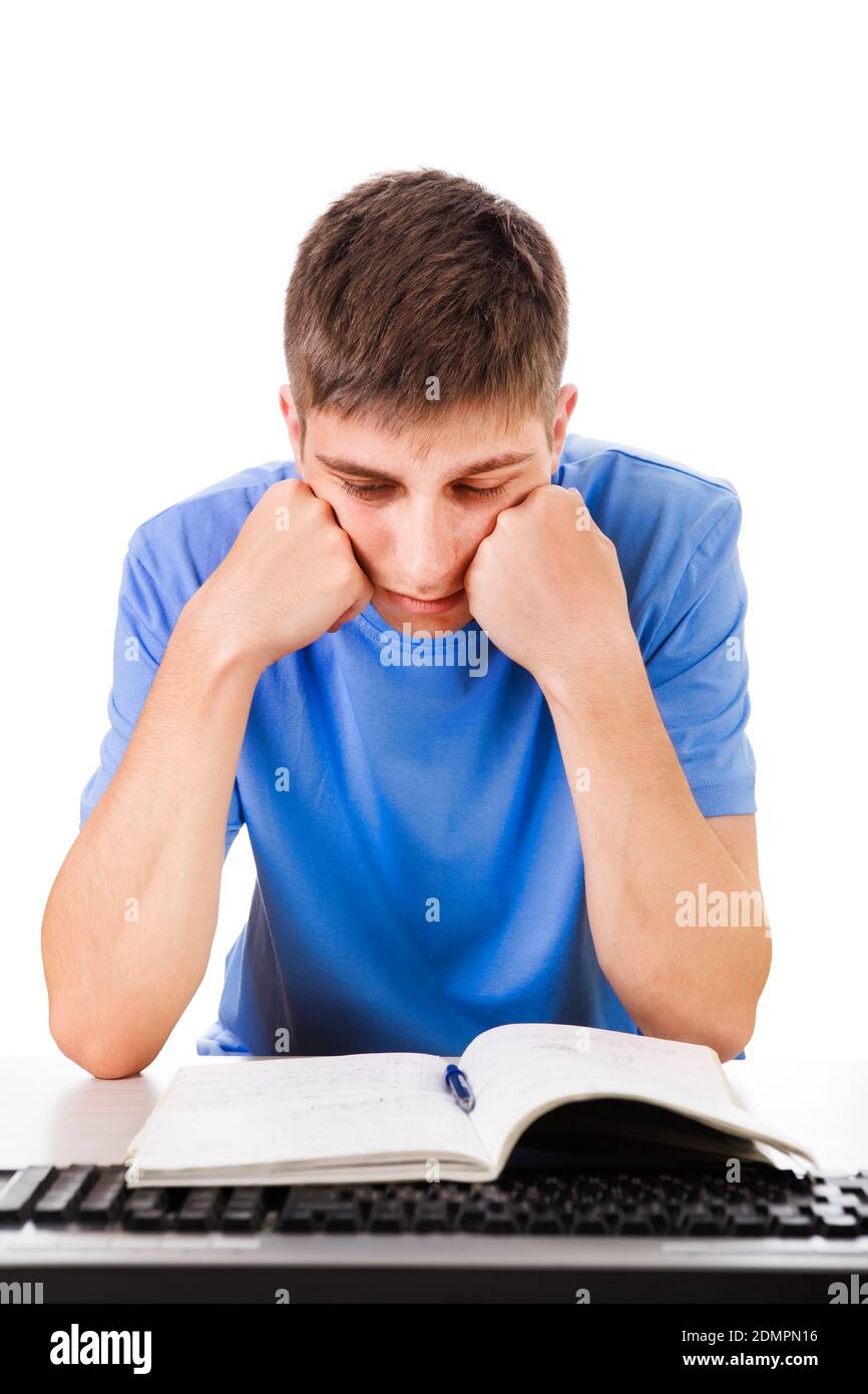 Tired teenager at table hi-res stock photography and images - Alamy
