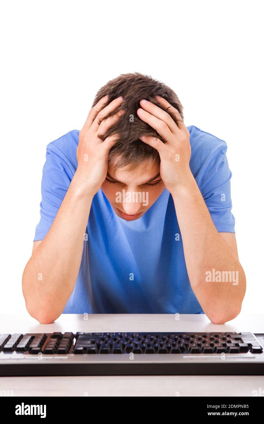 Sad Young Man with a Computer Keyboard on the White Background Stock ...