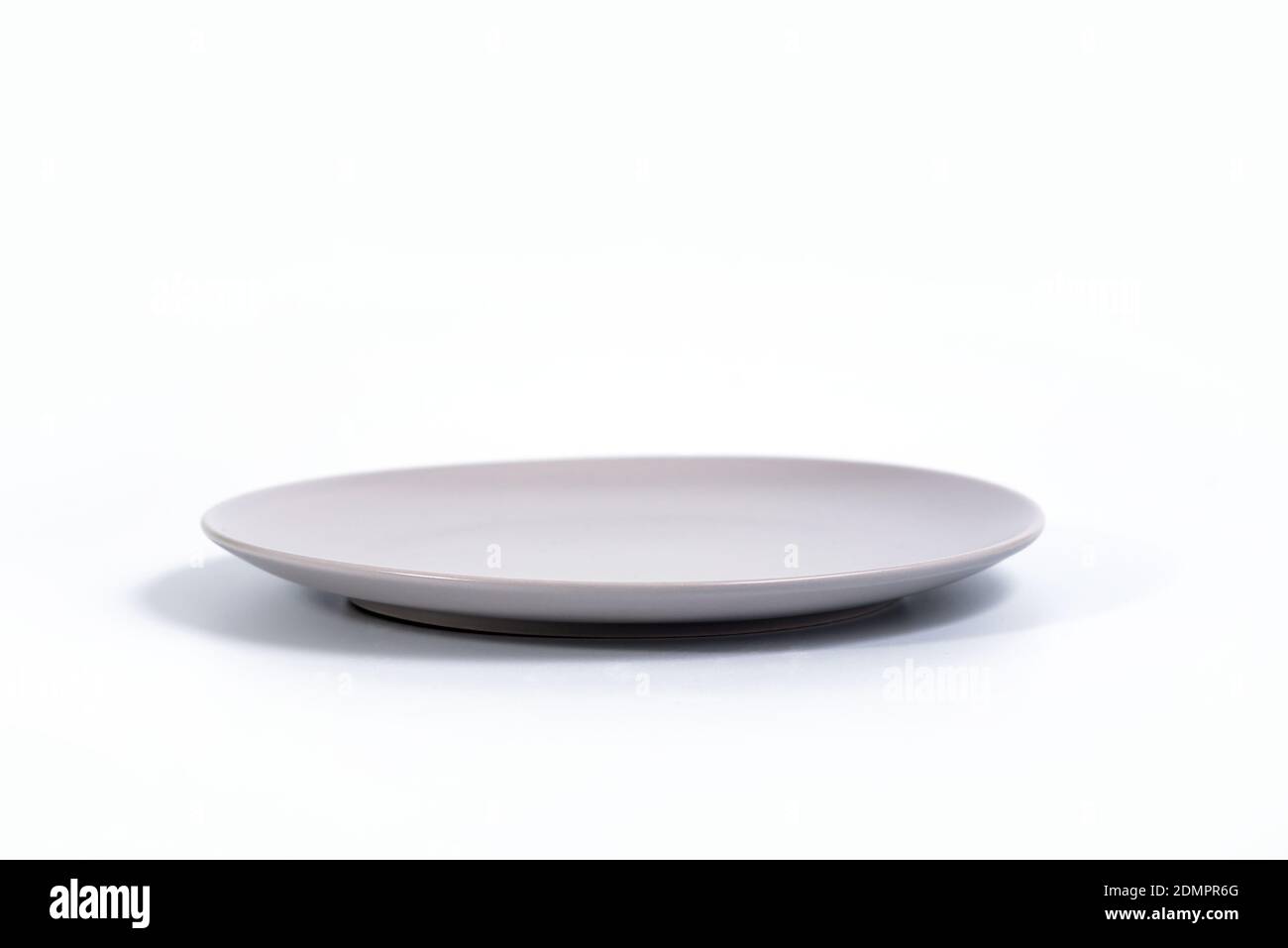 Empty Gray plate isolated on white background side view, selective ...