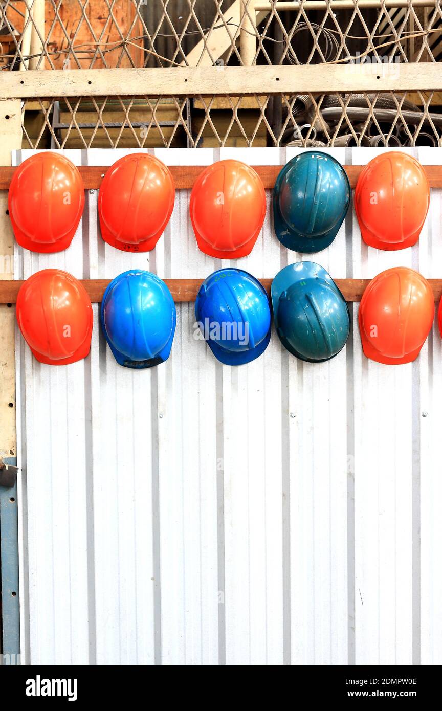 Hardhats hanging hi-res stock photography and images - Alamy
