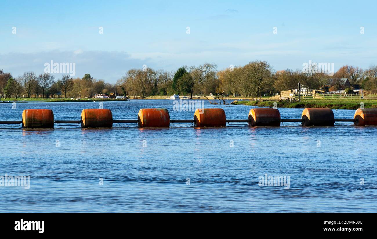 Orange safety boom across a river Stock Photo - Alamy