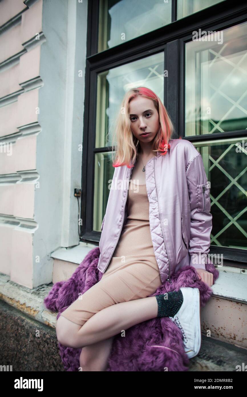 teenage girl infront of university building smiling, having fun ...