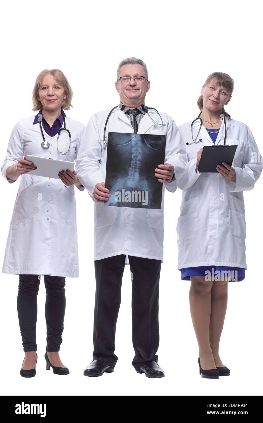 Group of doctors looking at x-ray and tablet pc Stock Photo - Alamy