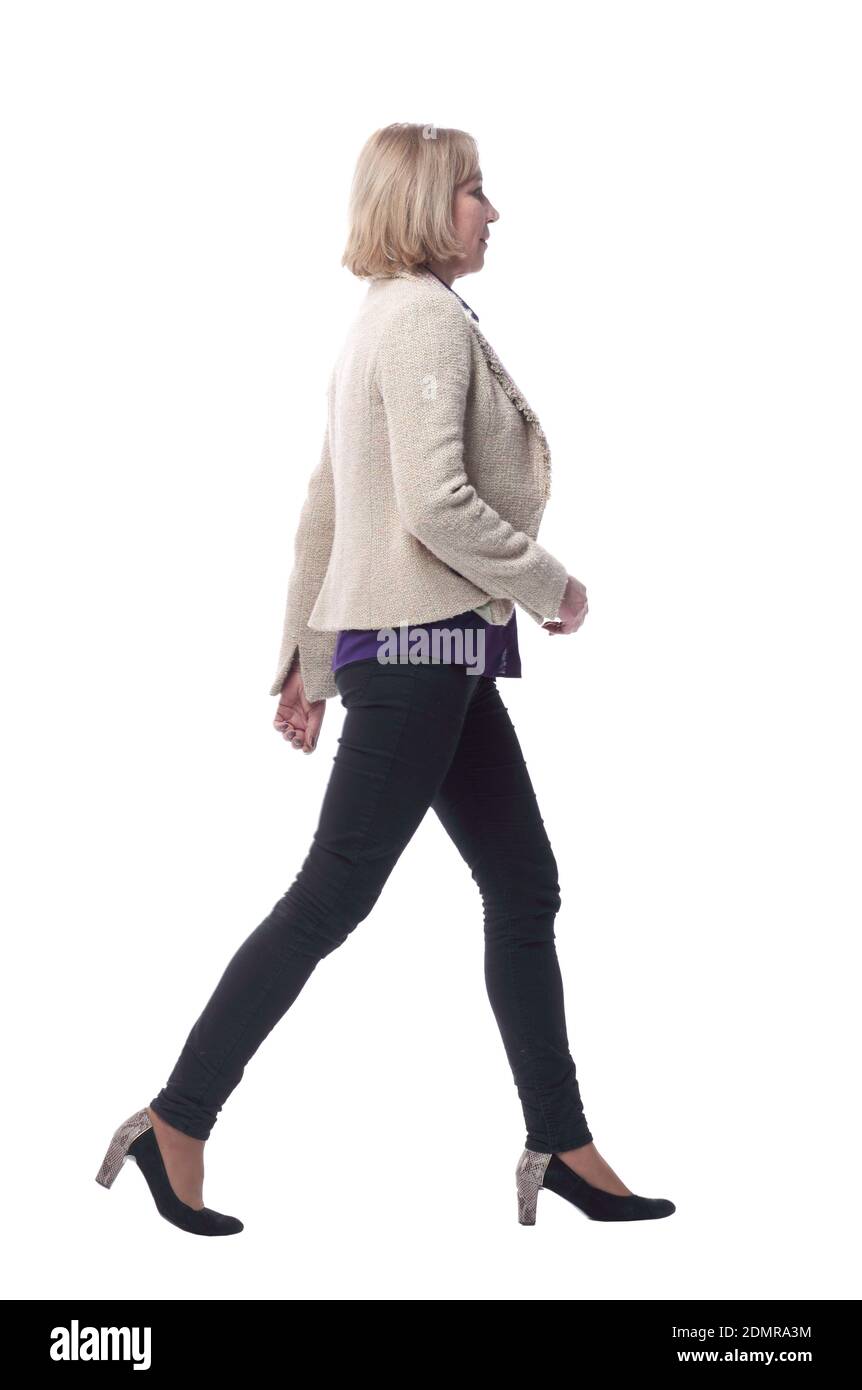 Portrait of casual woman walking straight and smiling Stock Photo - Alamy