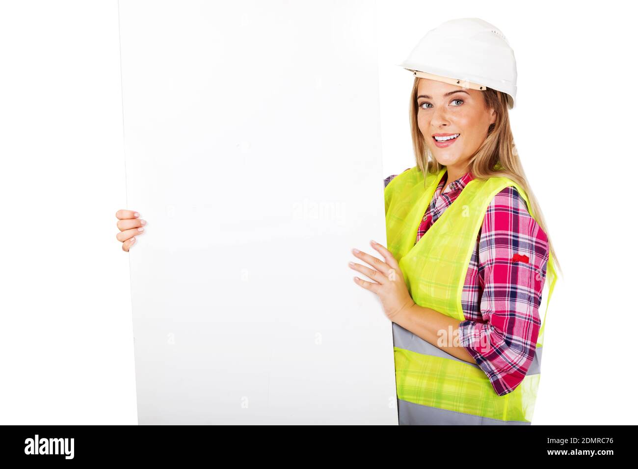 Portrait Of Engineer Holding Blank Placard Against White Background ...