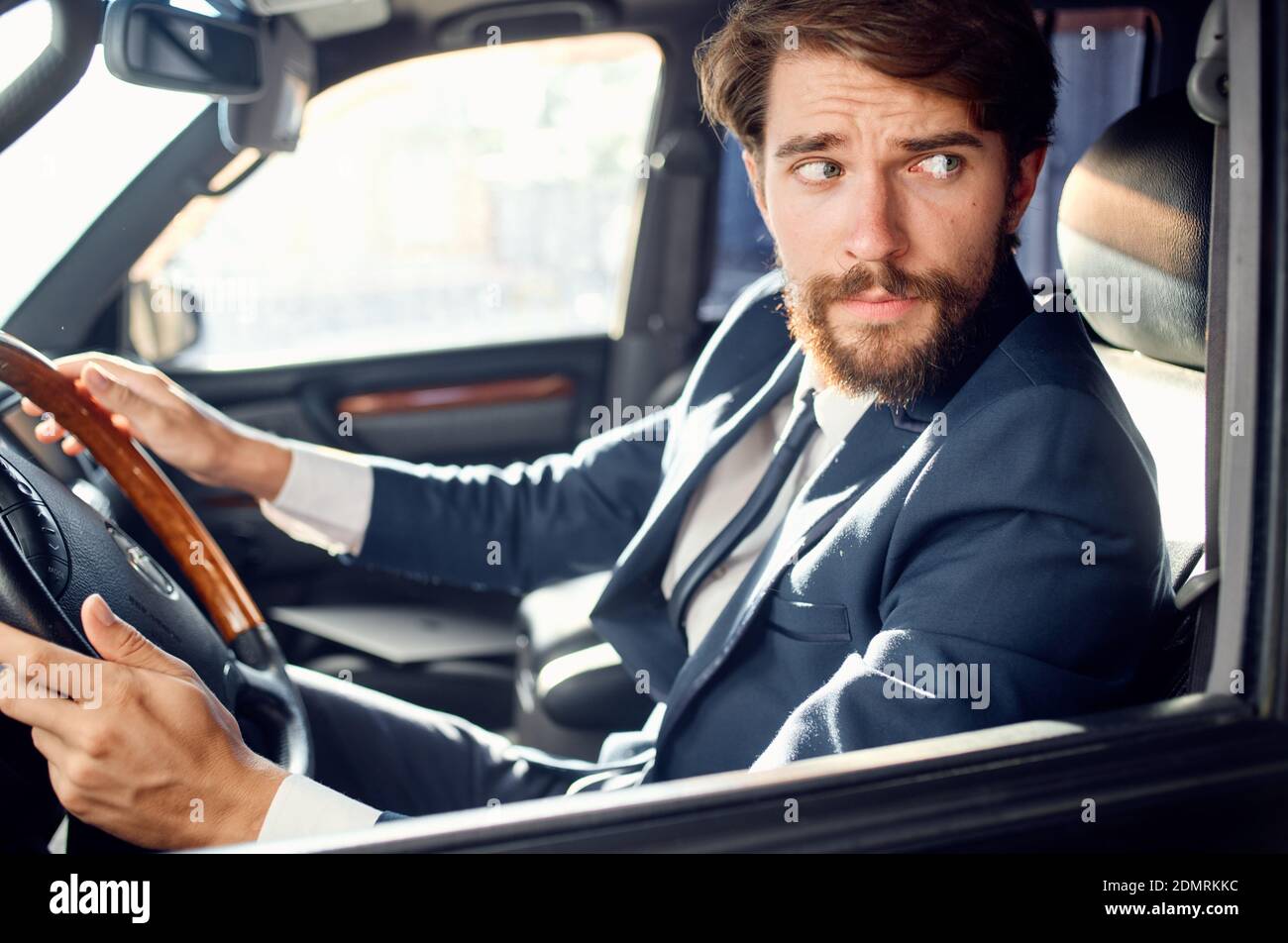 business man in suit driving a car trip luxury road Stock Photo - Alamy