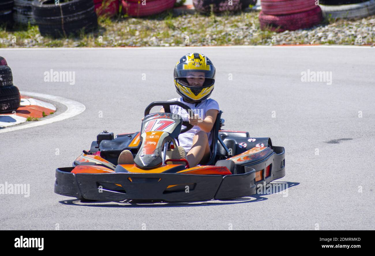 Karting competition or racing car riding for victory on a racetrack ...