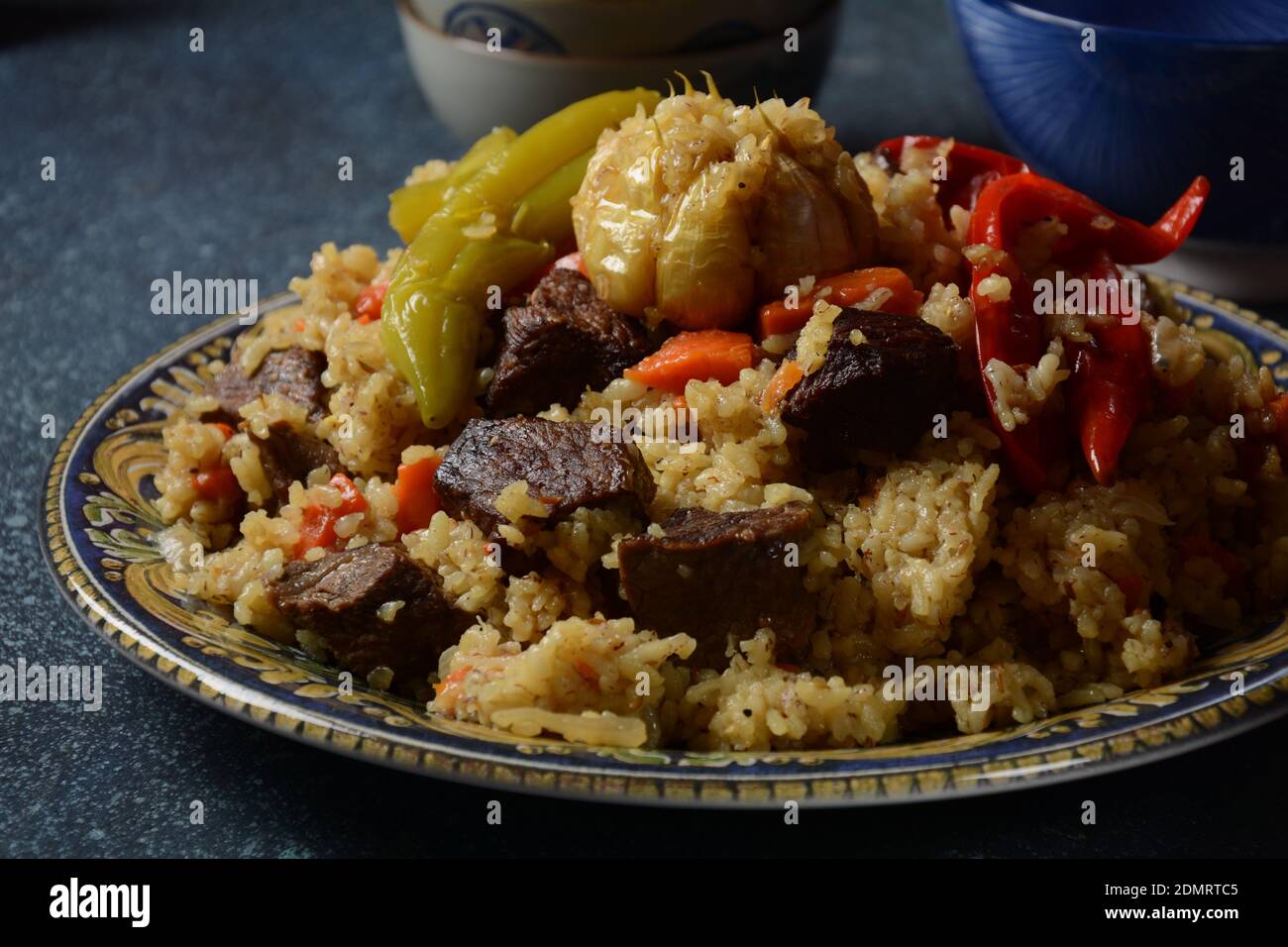 Uzbek cuisine (food) pilaf (plov).Mutton, rice, carrots, vegetable oil ...