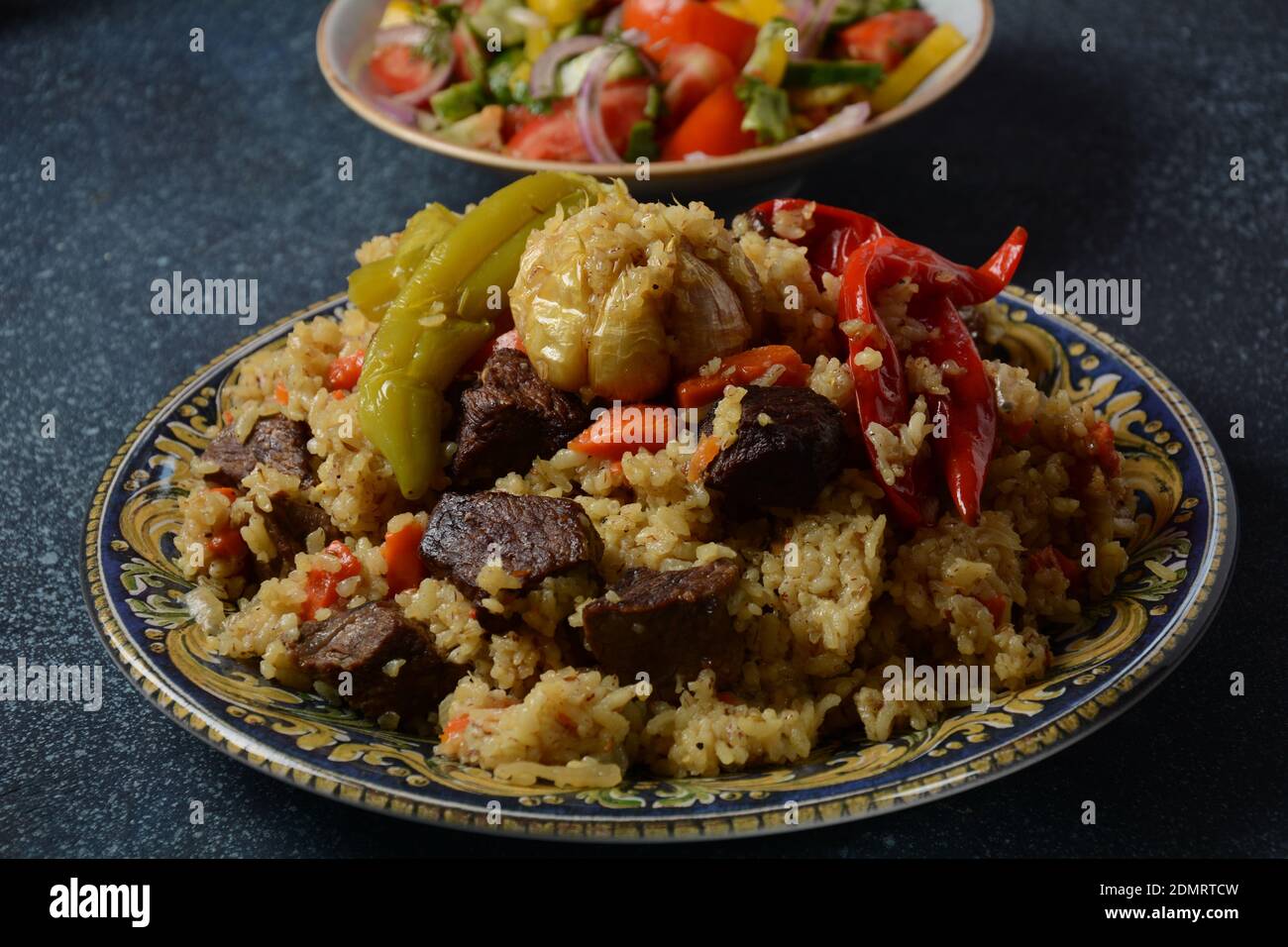 Uzbek cuisine (food) pilaf (plov), salad achichuk (achuchuk).Mutton ...