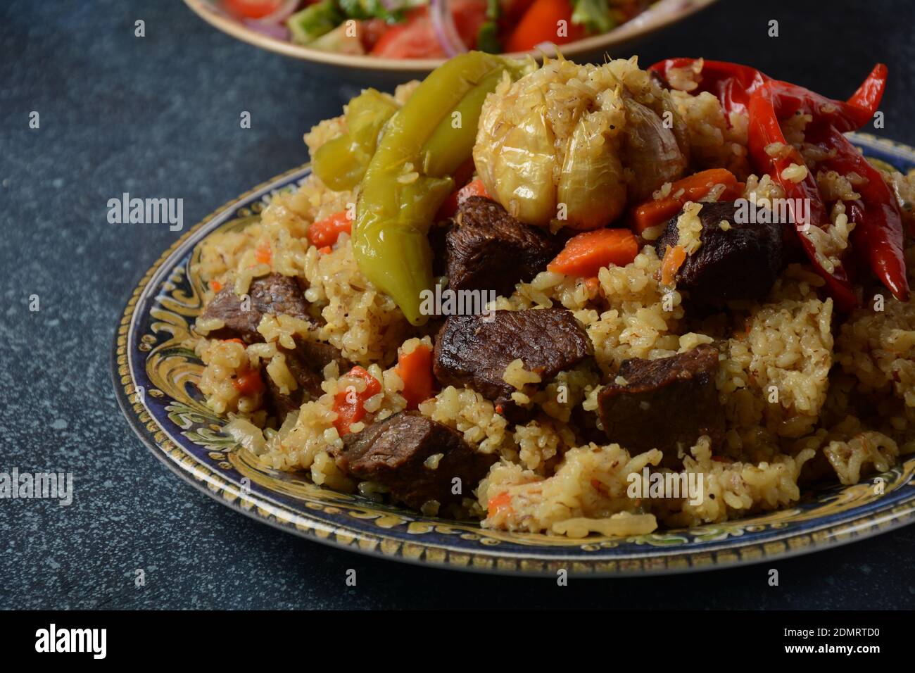Uzbek cuisine (food) pilaf (plov), salad achichuk (achuchuk).Mutton ...