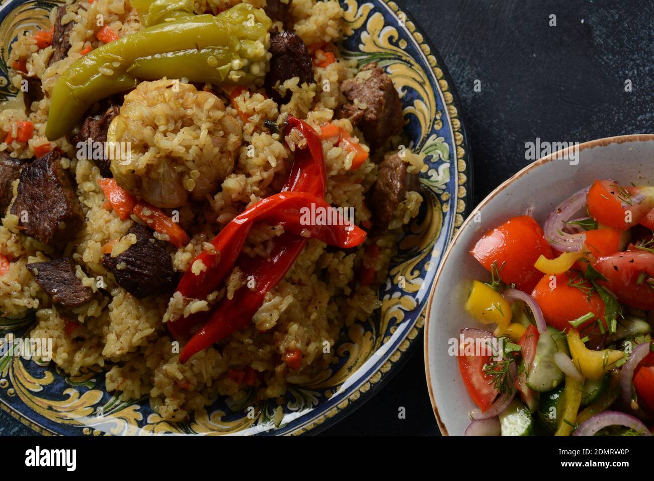 Uzbek cuisine (food) pilaf (plov), salad achichuk (achuchuk).Mutton ...