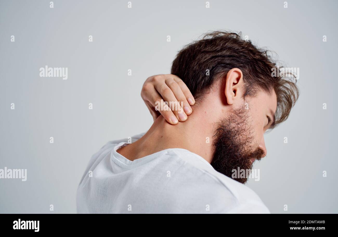 man touching his neck with his hand osteochondrosis back pain Stock ...