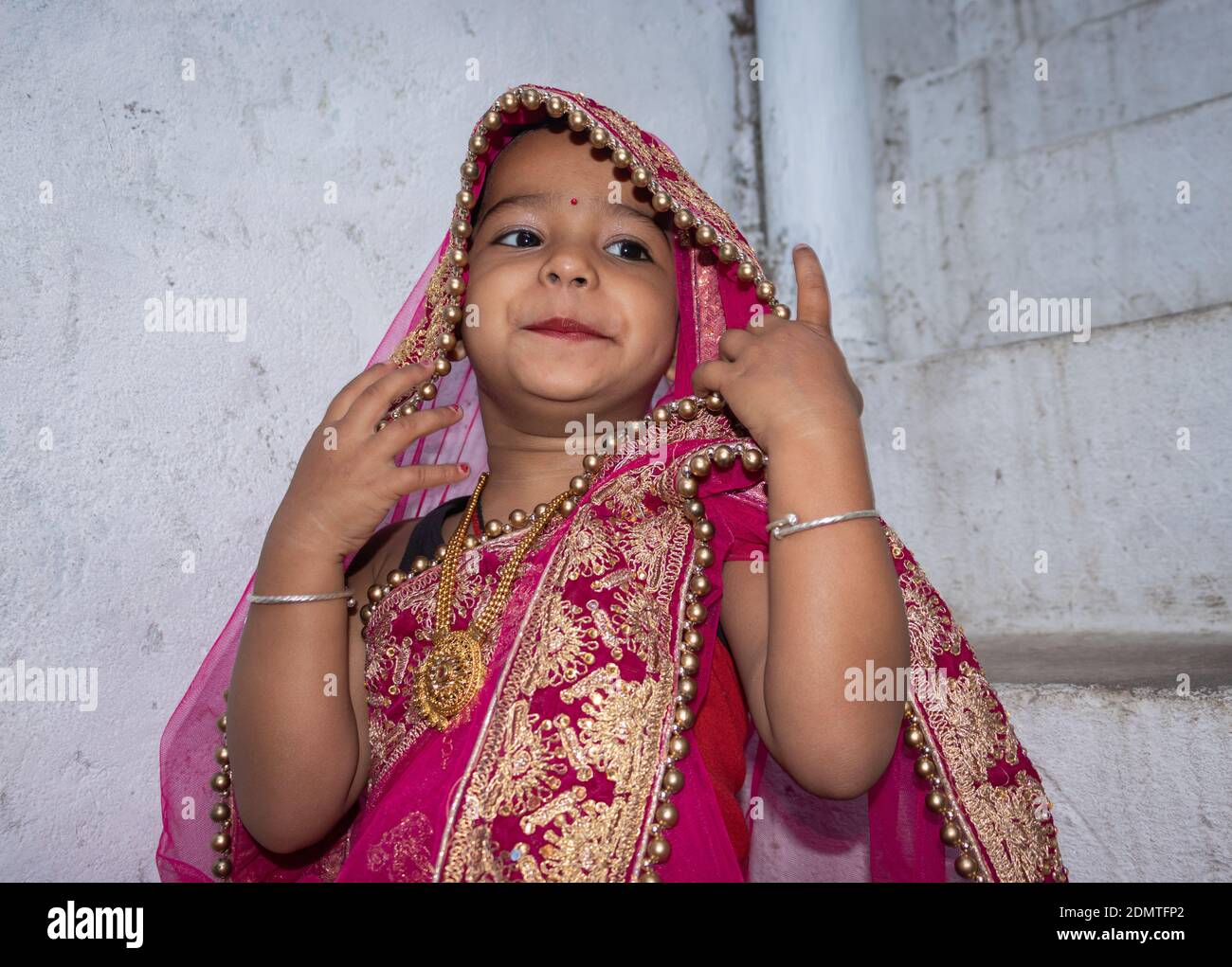 Indian girl wearing pink sari hi-res stock photography and images - Alamy