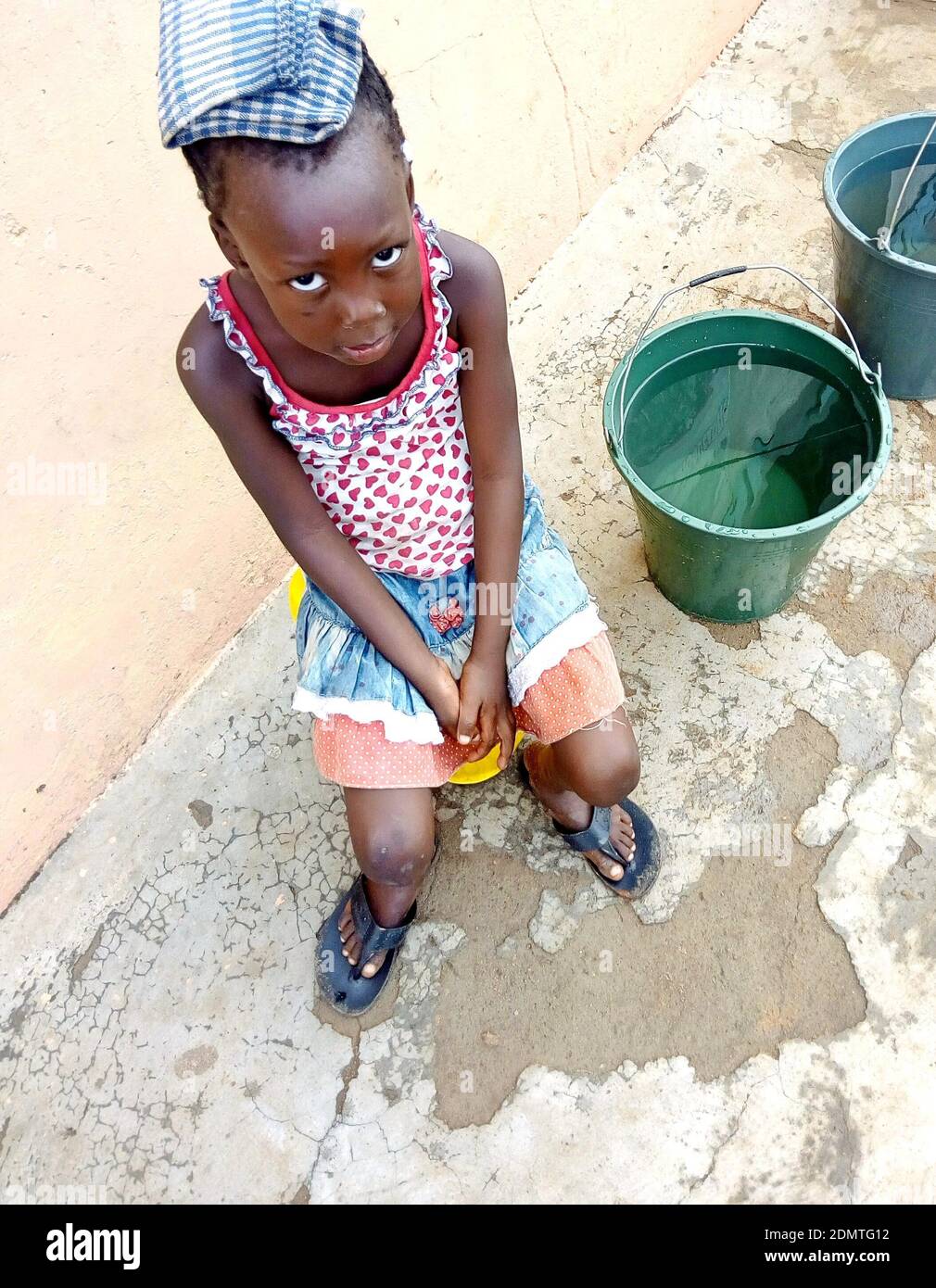 Girls carrying bucket hi-res stock photography and images - Alamy