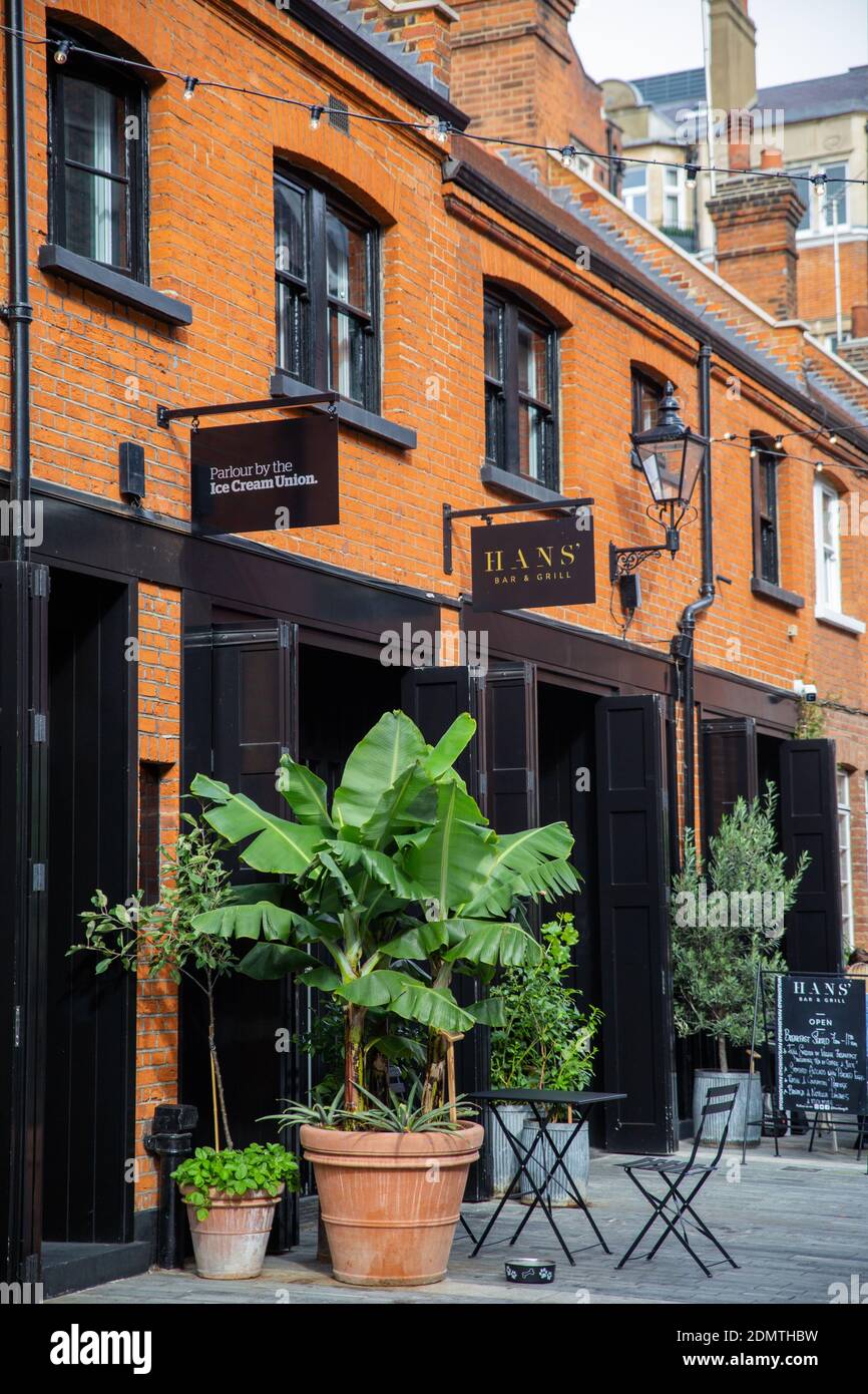 Row of brick buildings with restaurants in Pavilion Road Stock Photo ...
