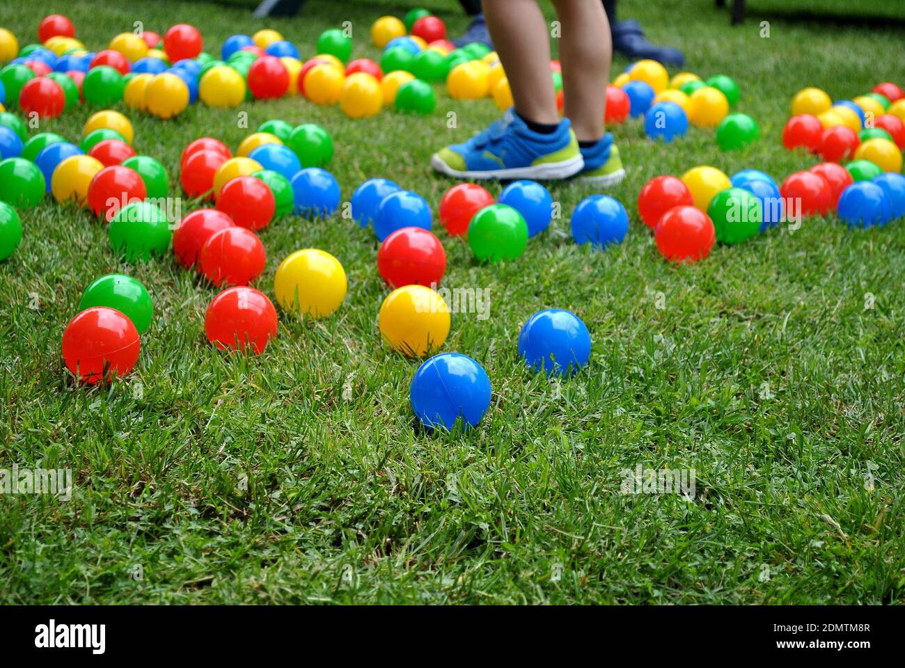 Colorful Ball In The Garden Stock Photo - Alamy