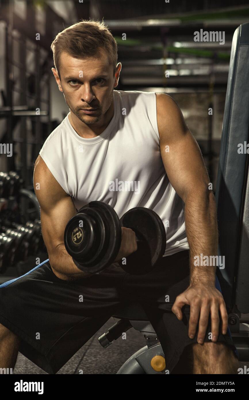 Intense training. Vertical shot of a serious young handsome man looking ...