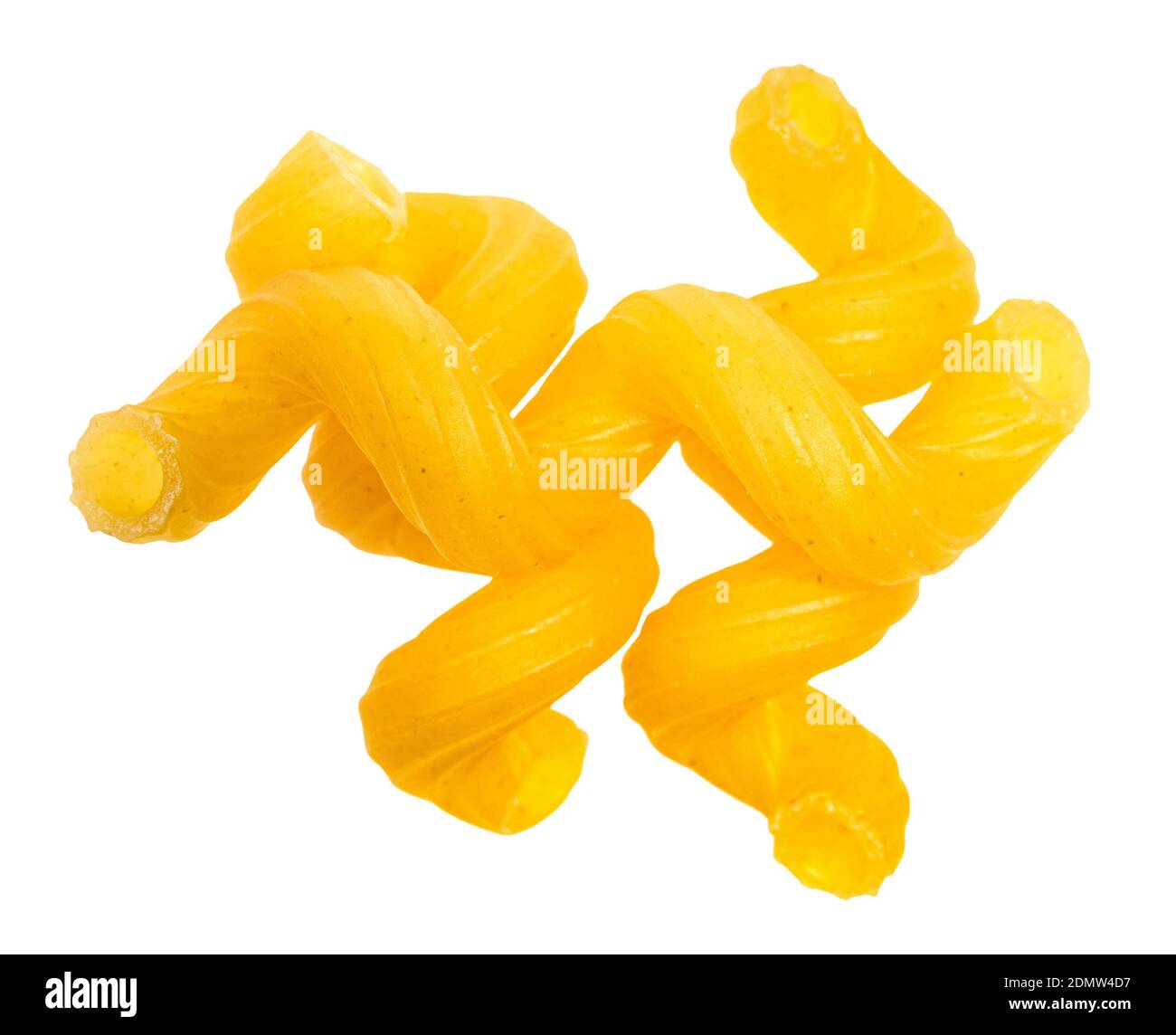 three dried Cavatappi (variety of italian short pasta) close up ...