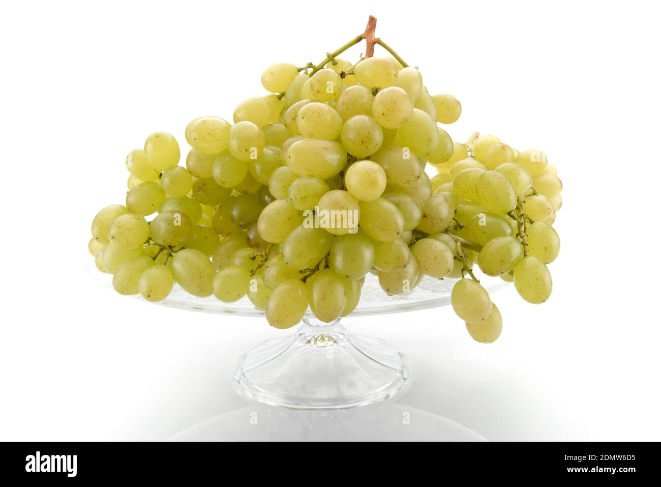 white table grapes top view on yellow background Stock Photo - Alamy
