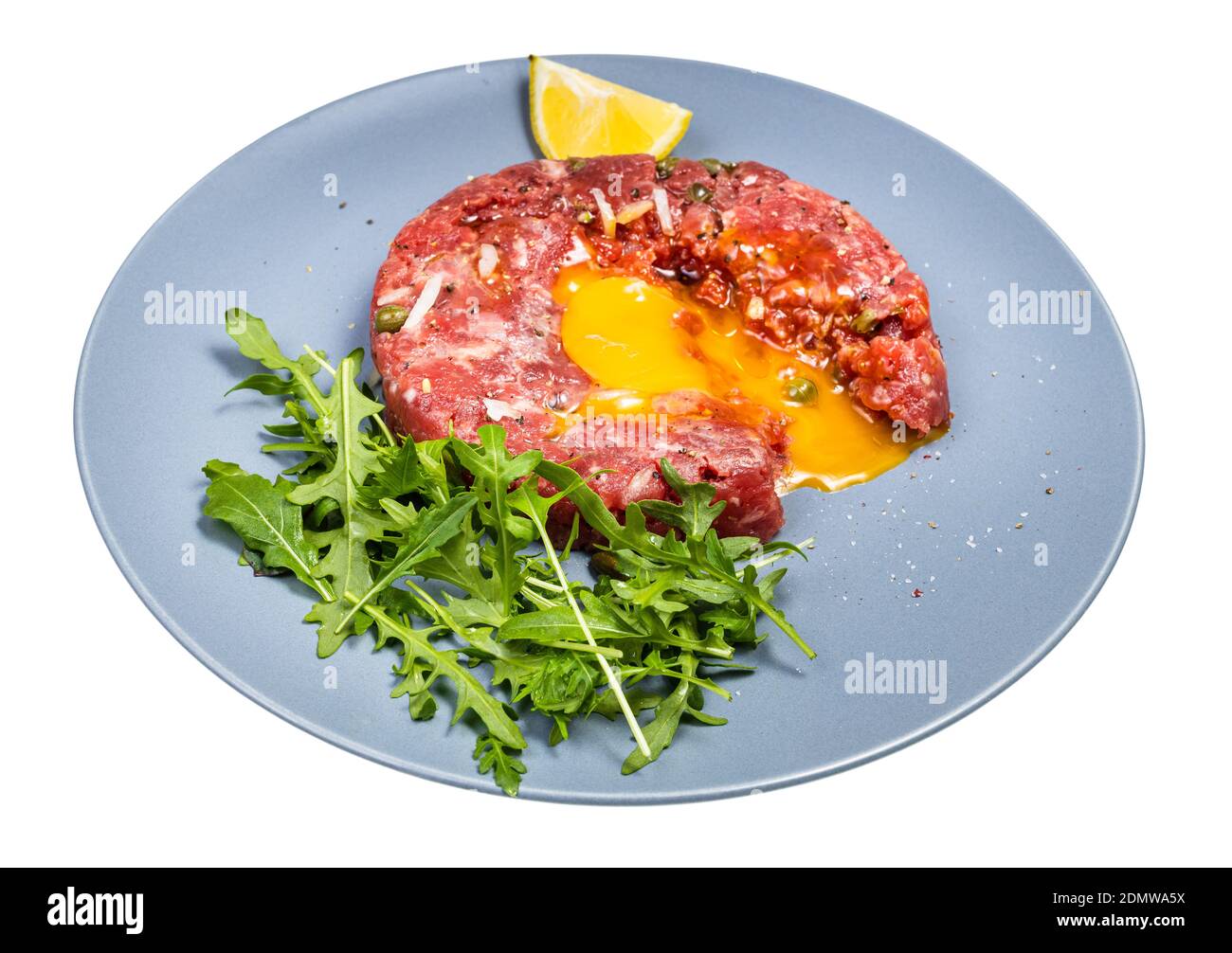 served Steak tartare (raw minced beef meat and chopped onion with raw ...