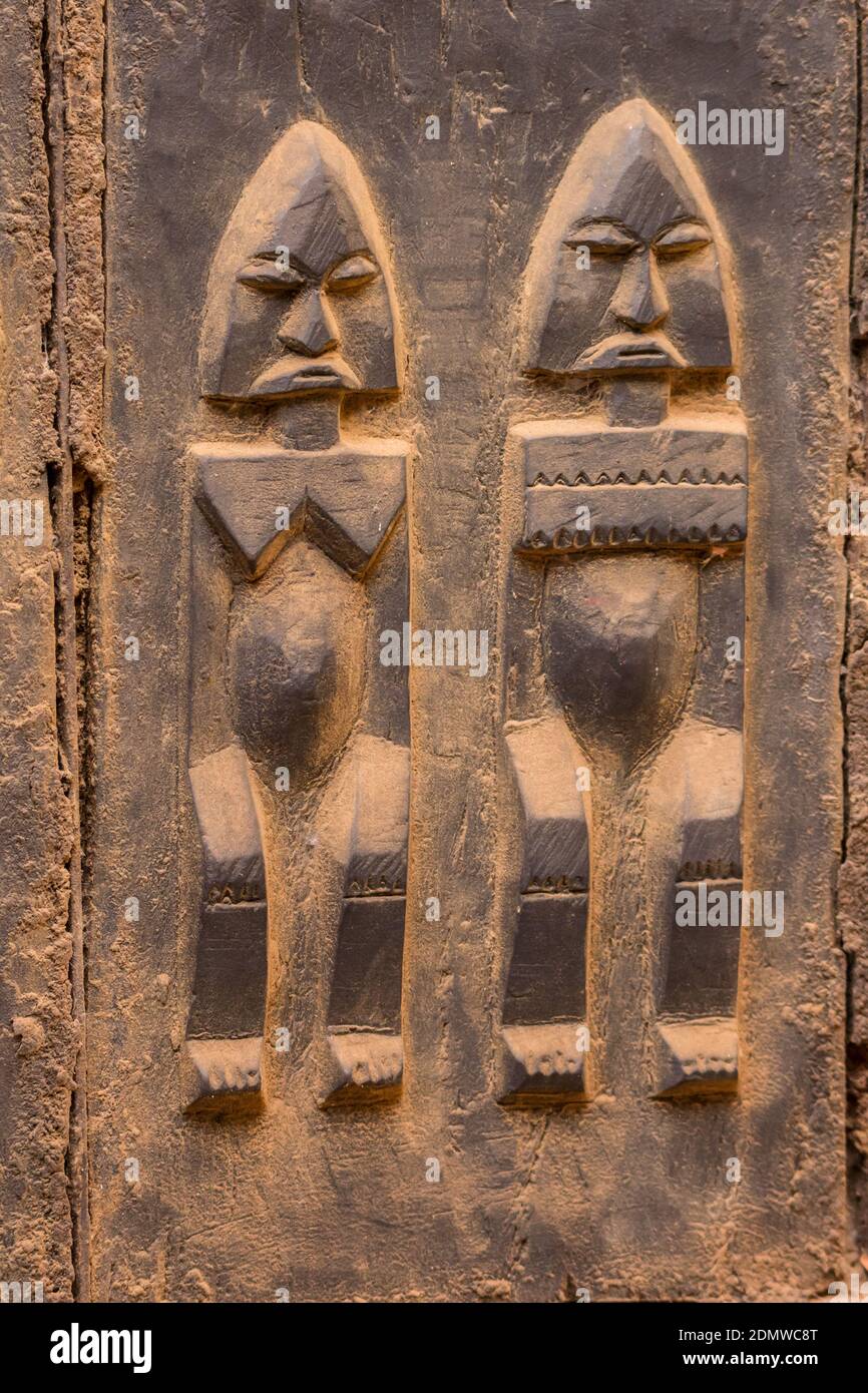 Detail of a beautifully carved Dogon door depicting daily life and ...