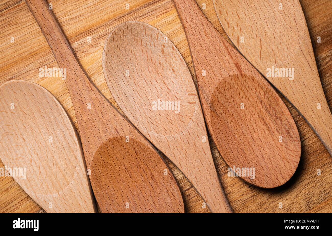Pattern of wood spoons on textured wood background Stock Photo - Alamy