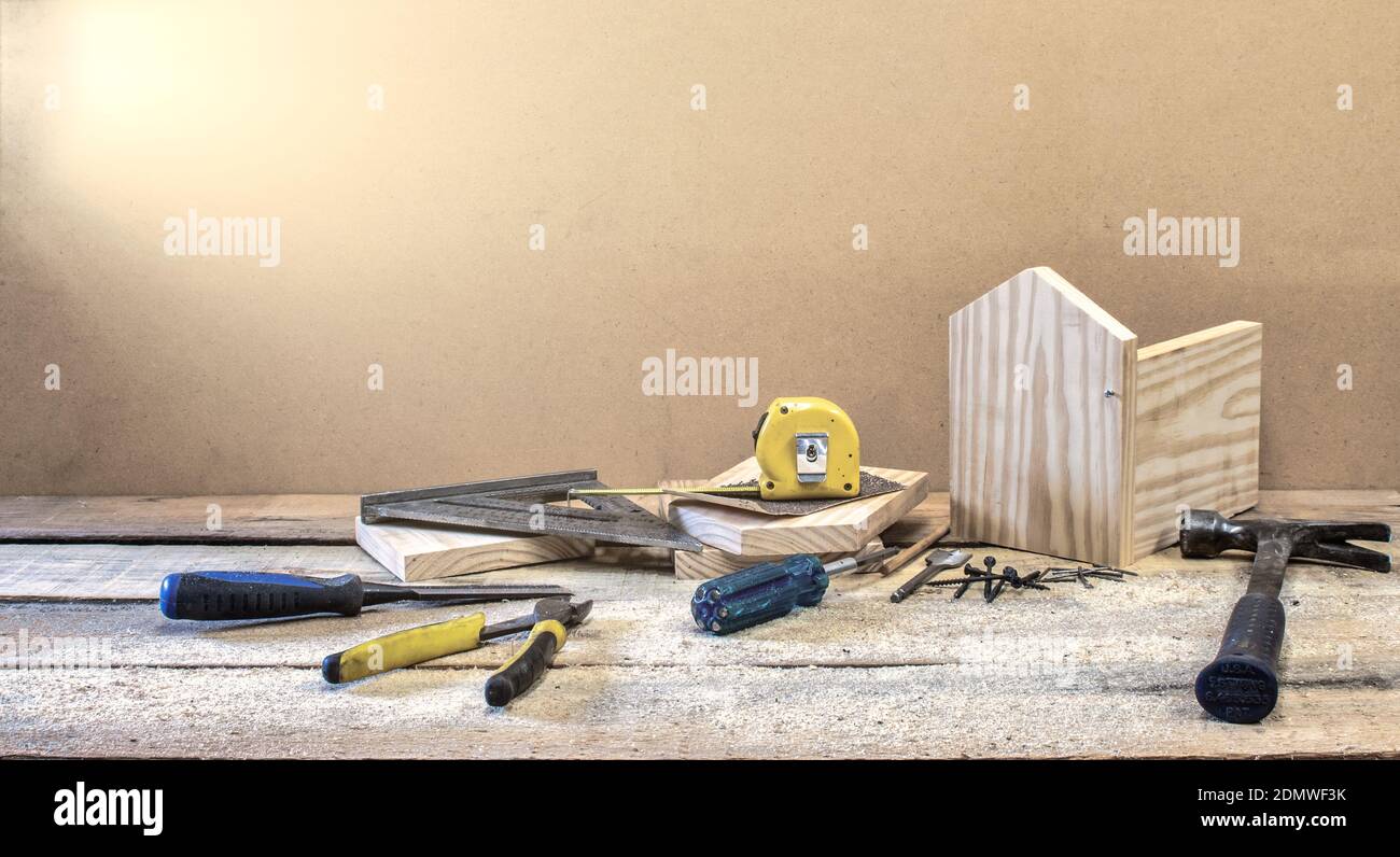 Tools On Table Against Wall Stock Photo - Alamy