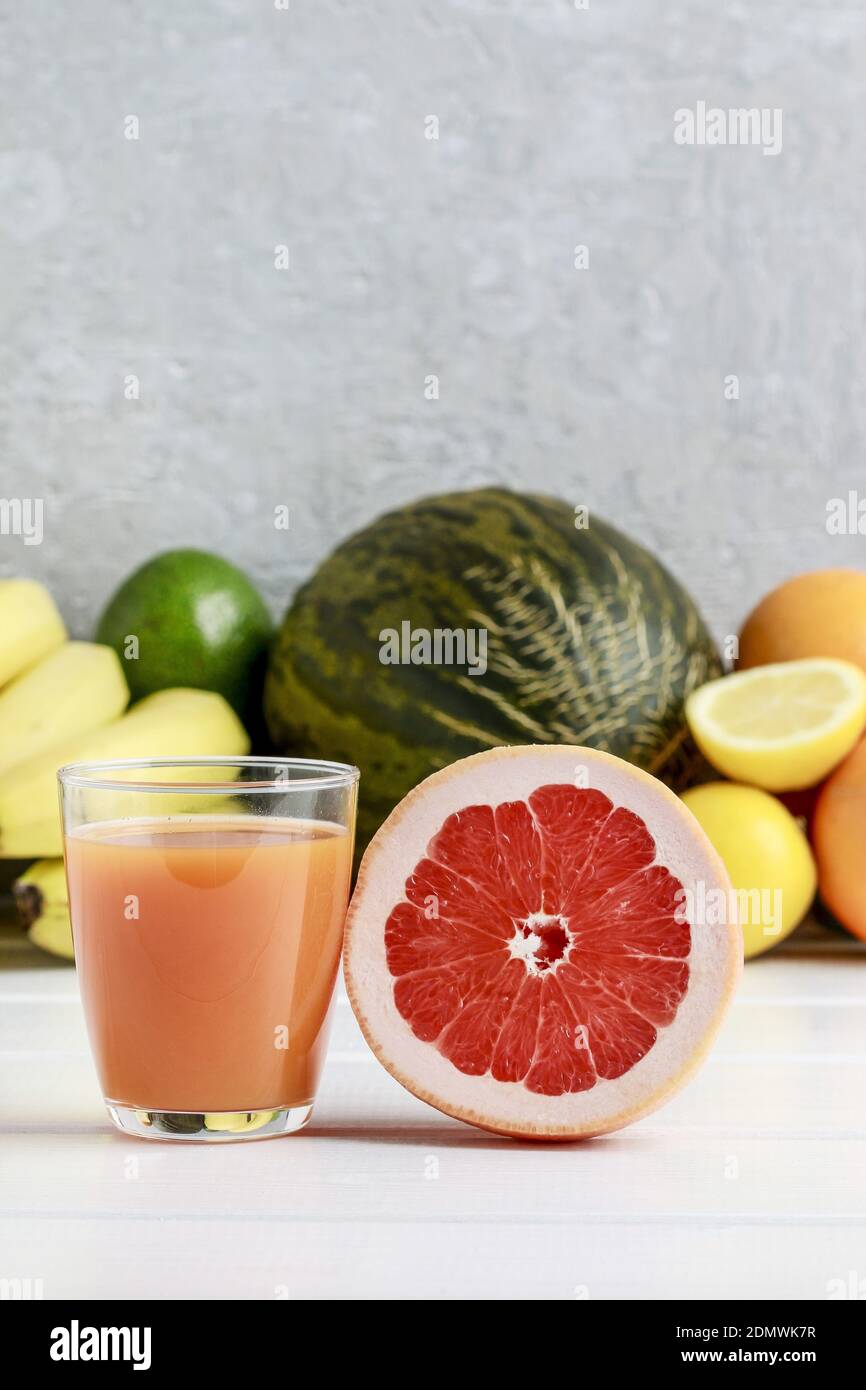 Glass of orange juice and stack of various fruits. Healthy food Stock ...