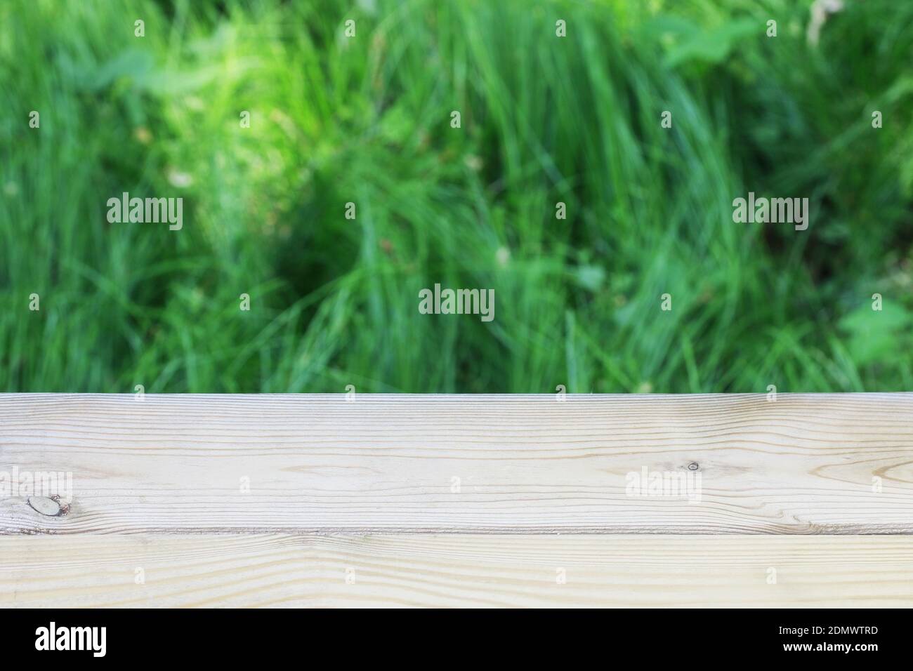 Wooden table top and forest grass background, copy space Stock Photo ...